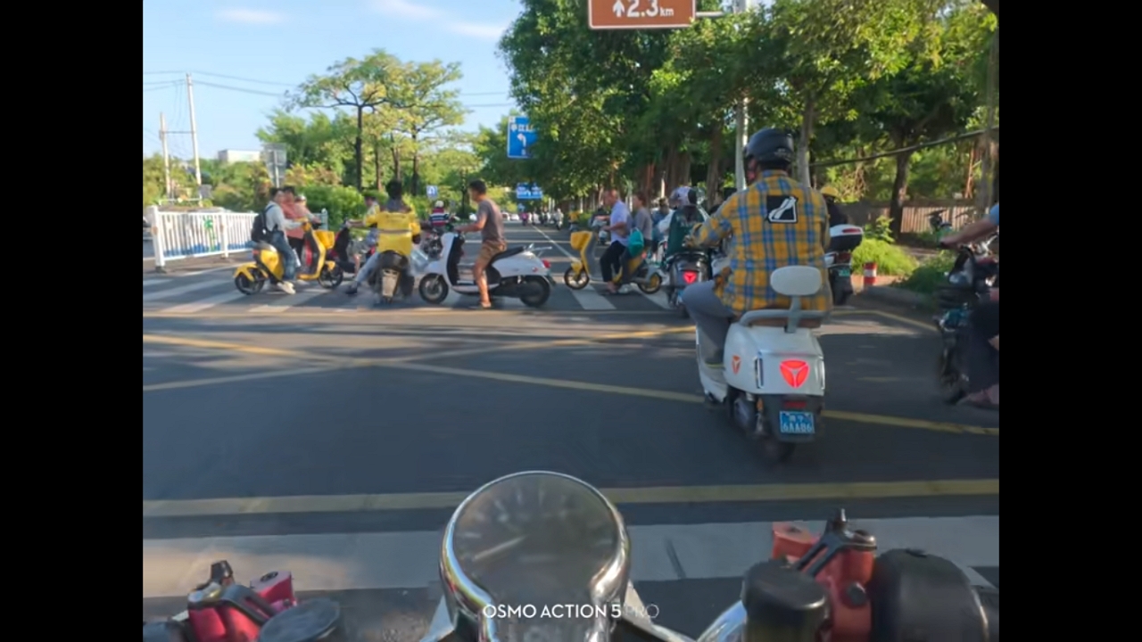 Close call involving scooter rider at a pedestrian crossing in Guangxi ...