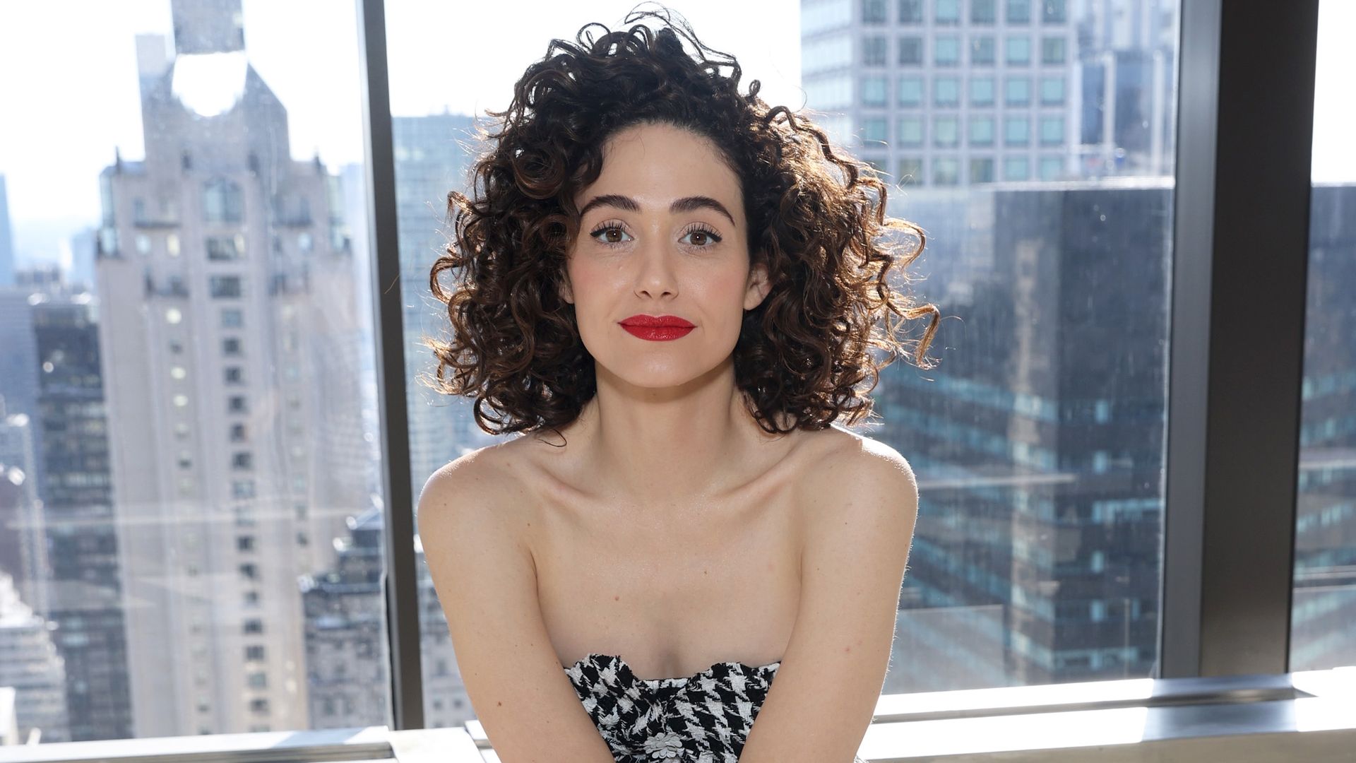 9 popular curly layered hairstyles stylists are raving about - including the viral ‘wolf cut’