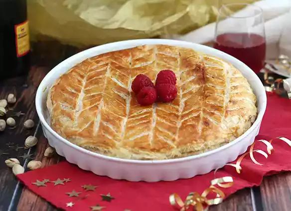 King cake with raspberry pistachio frangipane