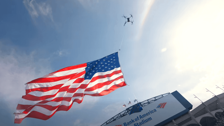 Asheville police drone unit displays giant American flag at Panthers game