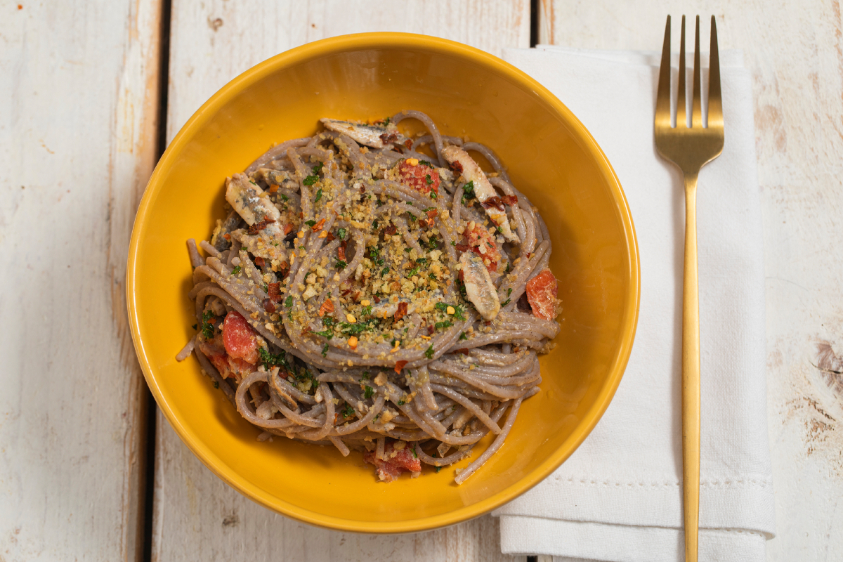 Buckwheat spaghetti with anchovies and cherry tomatoes