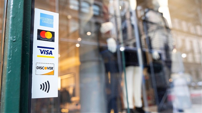 Here's Why Some Businesses Charge You Extra For Using A Credit Card