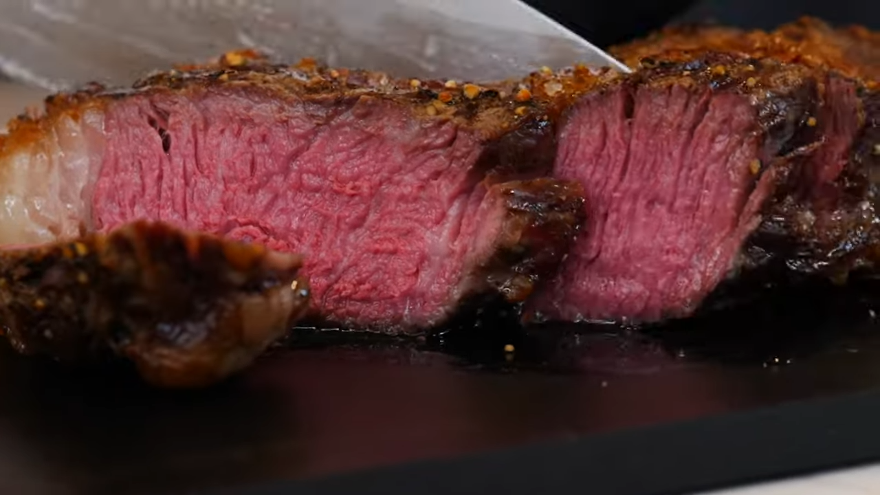 Juicy ribeye steak with birria butter