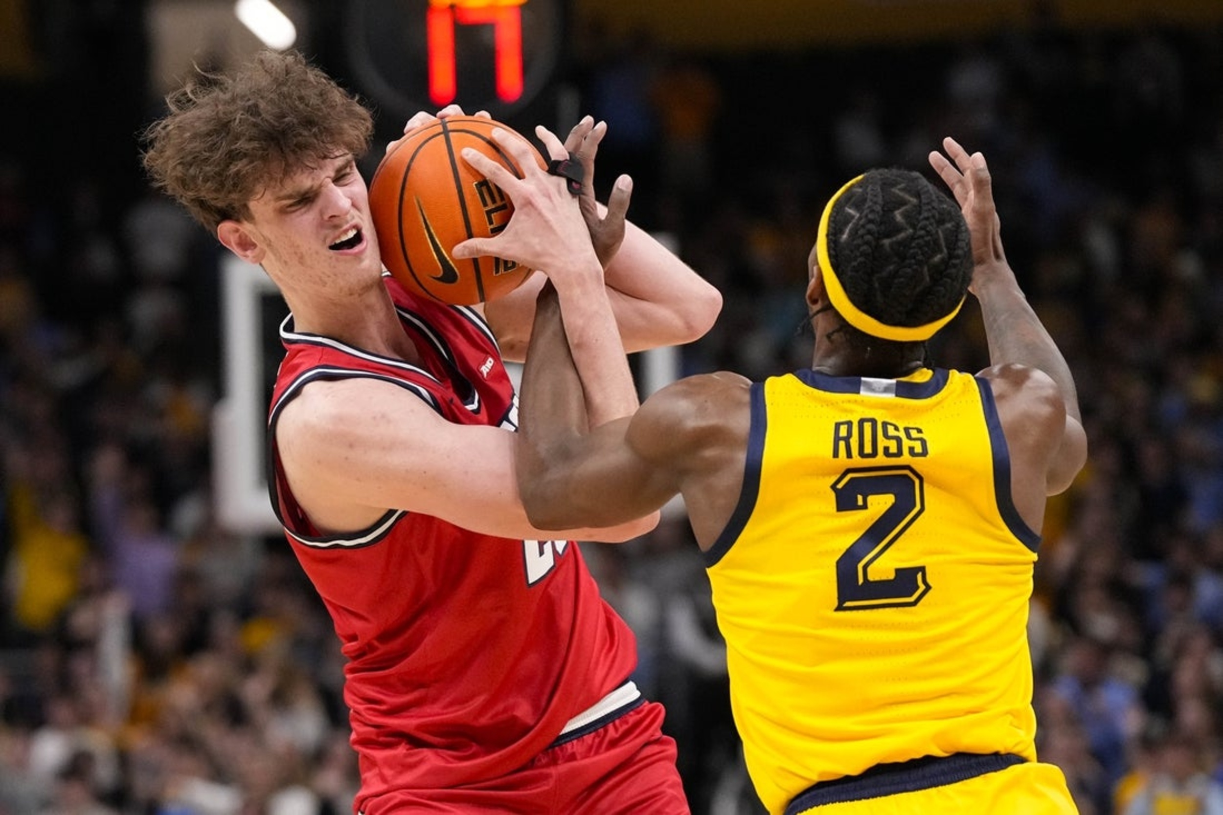 Dayton outlasts host Marquette in overtime