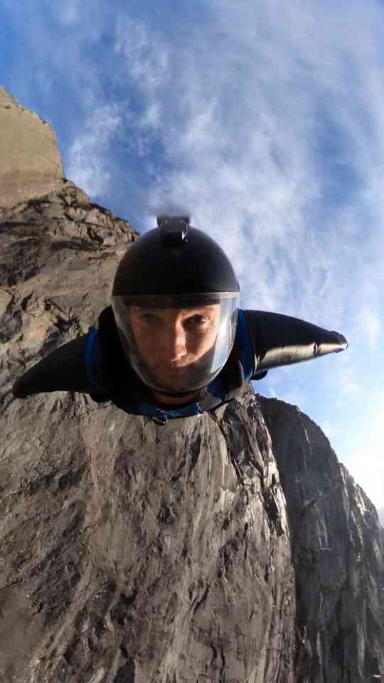 Man makes a stunning golden hour BASE jump in a wingsuit