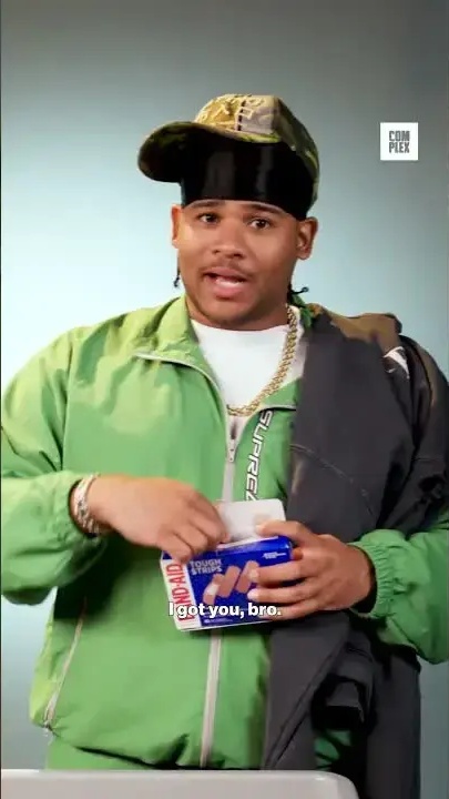 Fanum's airport essentials: hoodie, hat, and band-aids