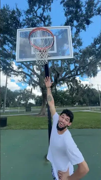 dunking on a super high basketball hoop