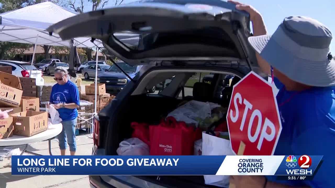 Hundreds of families wait in line for Thanksgiving food giveaway in ...