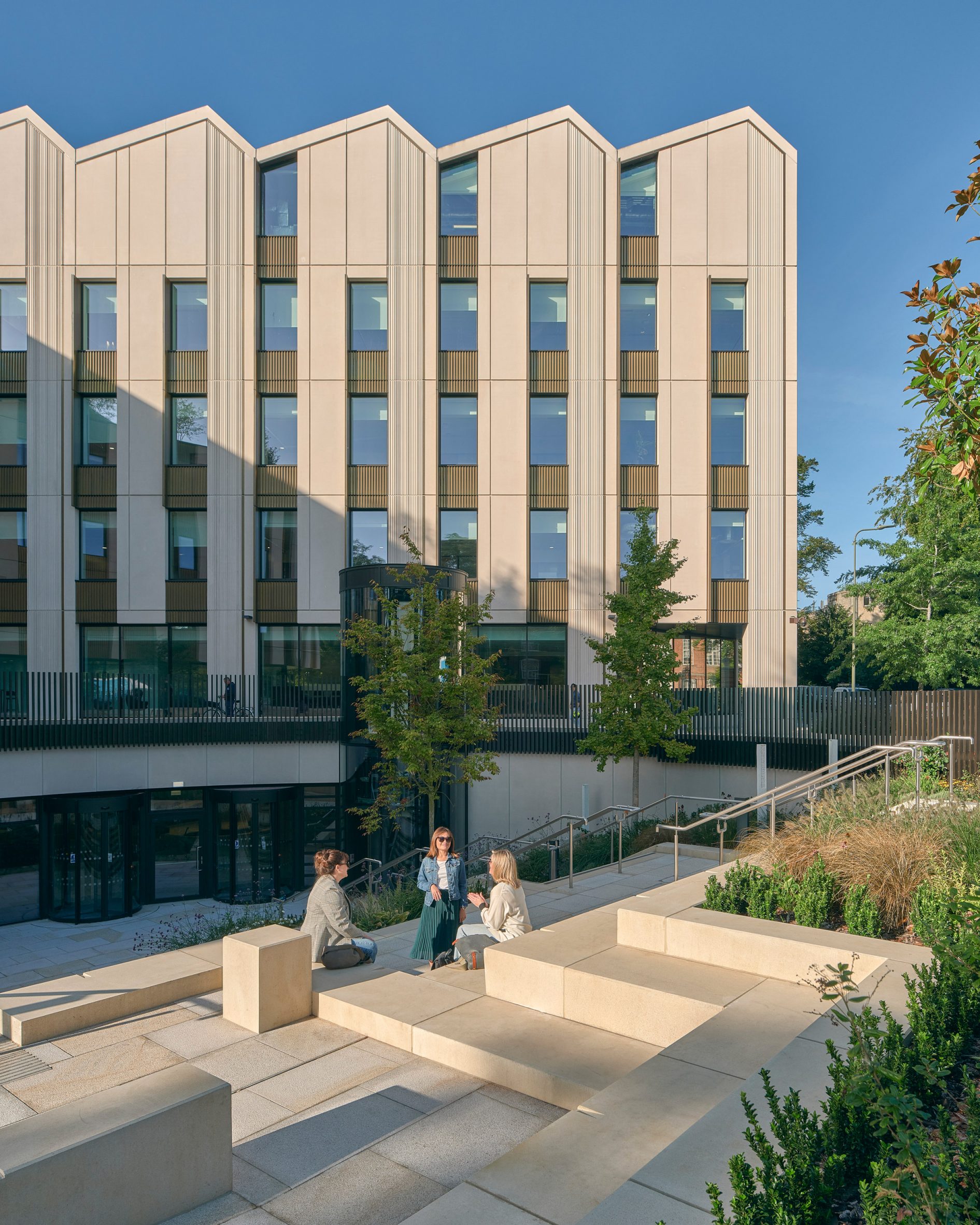 NBBJ clads University of Oxford science building in rippling stone panels