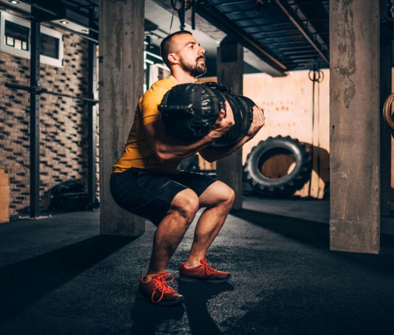 This Simple Sandbag Workout Builds the “Everyday Strength” Most Gym ...