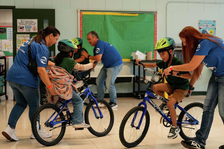HISD, OXY and Wish for Wheels deliver new bikes to Scroggins second graders