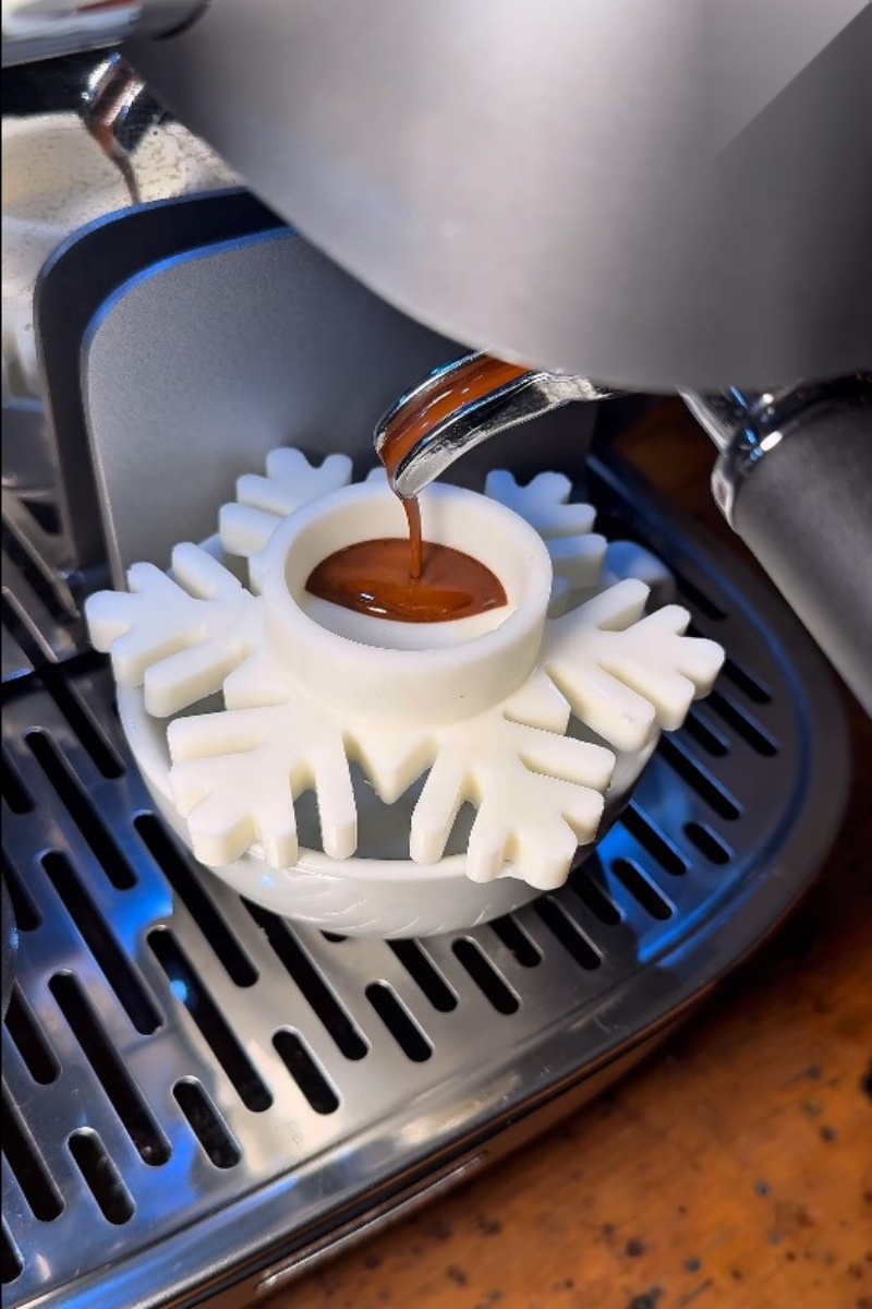 Espresso Pouring into a Snowflake-Shaped Coffee Mold