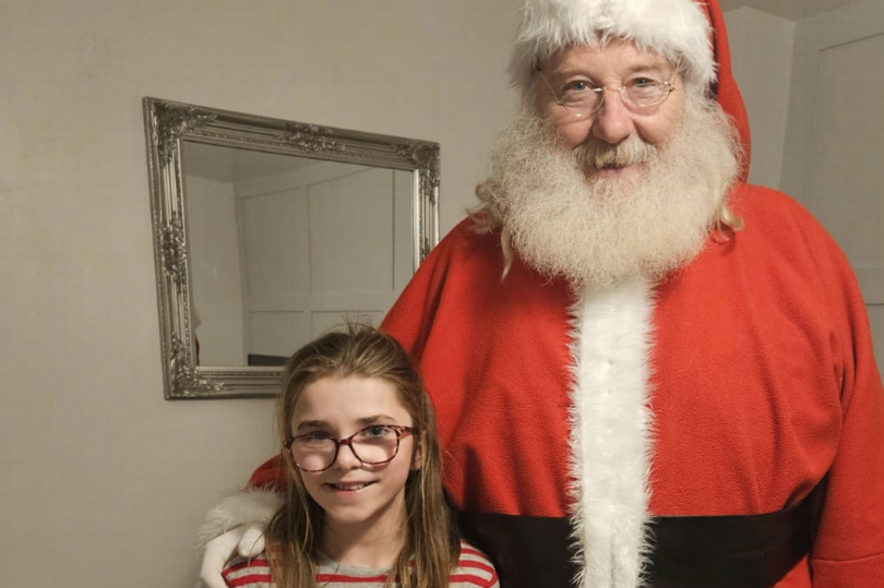Santa surprises schoolgirl with early Christmas as dad has just days to ...