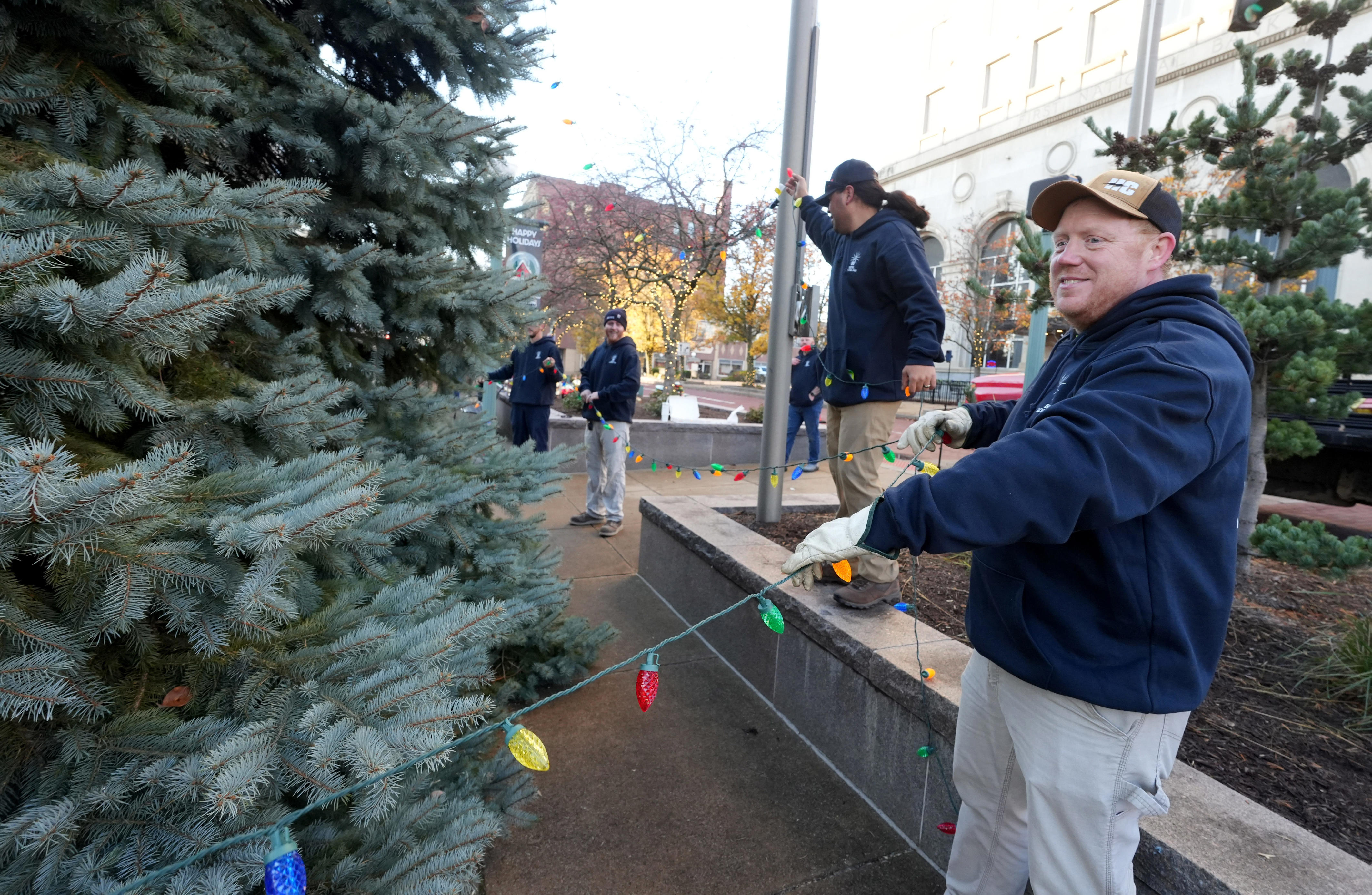 Volunteers from the IBEW 'power up downtown' Canton Christmas tree