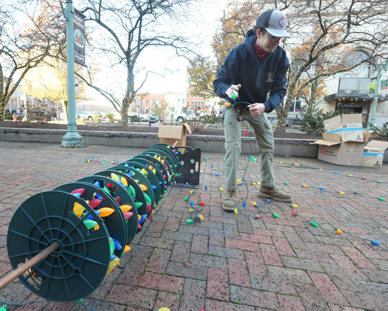 Volunteers from the IBEW 'power up downtown' Canton Christmas tree