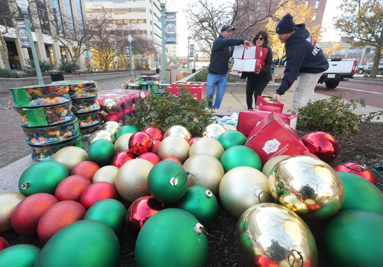 Volunteers from the IBEW 'power up downtown' Canton Christmas tree