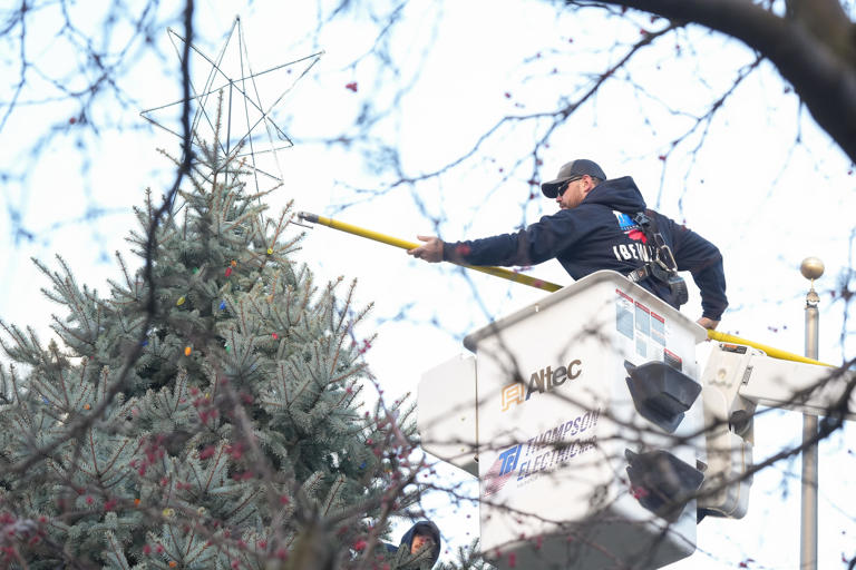 Volunteers from the IBEW 'power up downtown' Canton Christmas tree