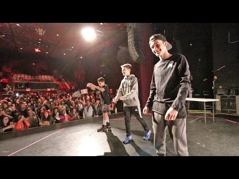 Skilled jumpers perform backflips on stage during live event