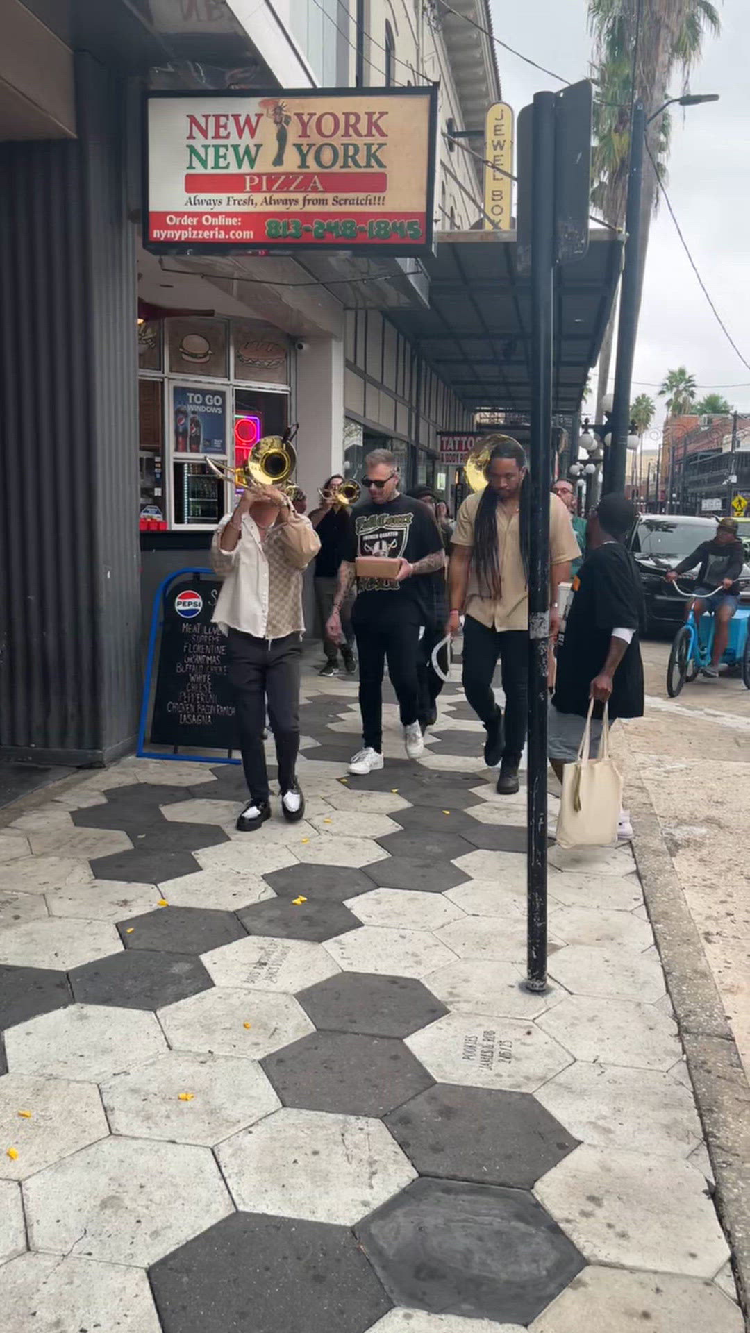 Brass band marches down 7th Ave in Ybor City to honor victims of deadly ...