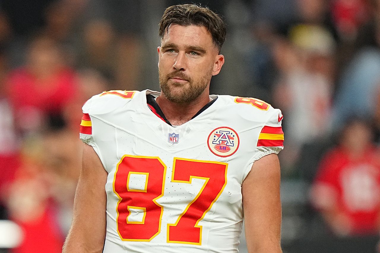 Travis Kelce signs baseballs for waiting fans after his first pitch at ...