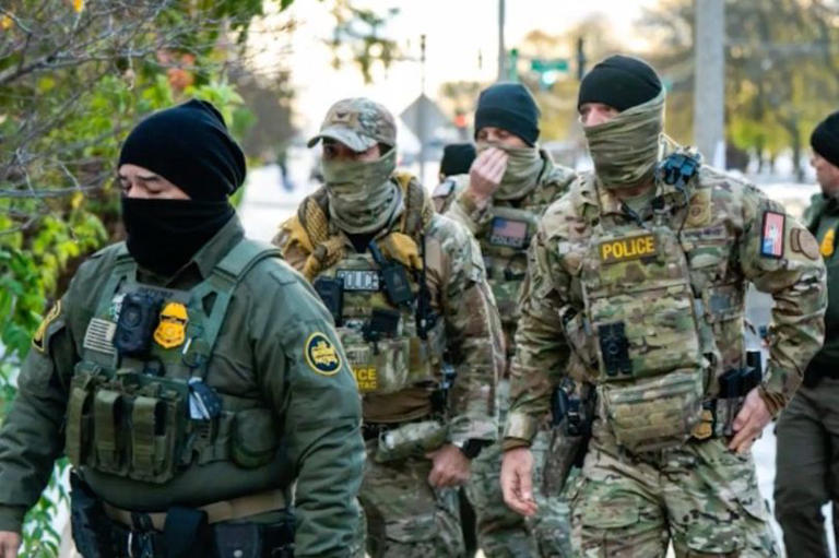 ICE agents pose at 'The Bean' for photoshoot after Chicago suburb raids