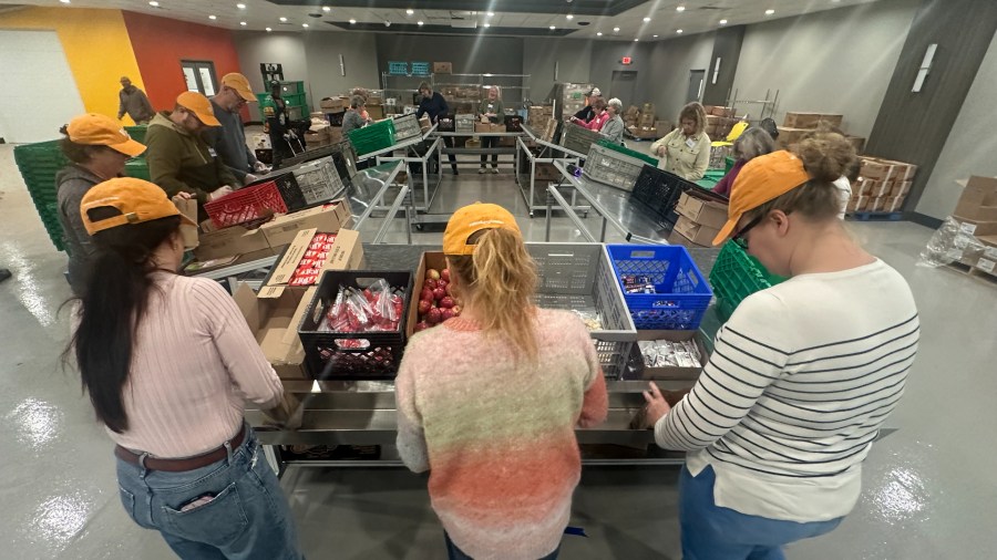 Kids’ Food Basket volunteers pack more meals amid rise in hungry children