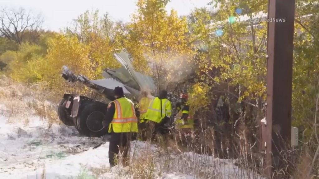 Train hits semi stuck on tracks due to snow in Gary, Indiana