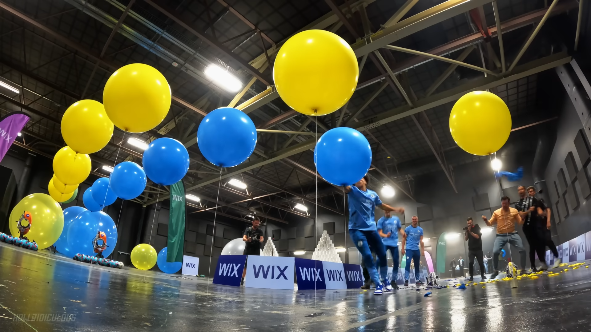 Football stars take on the balloon popping challenge