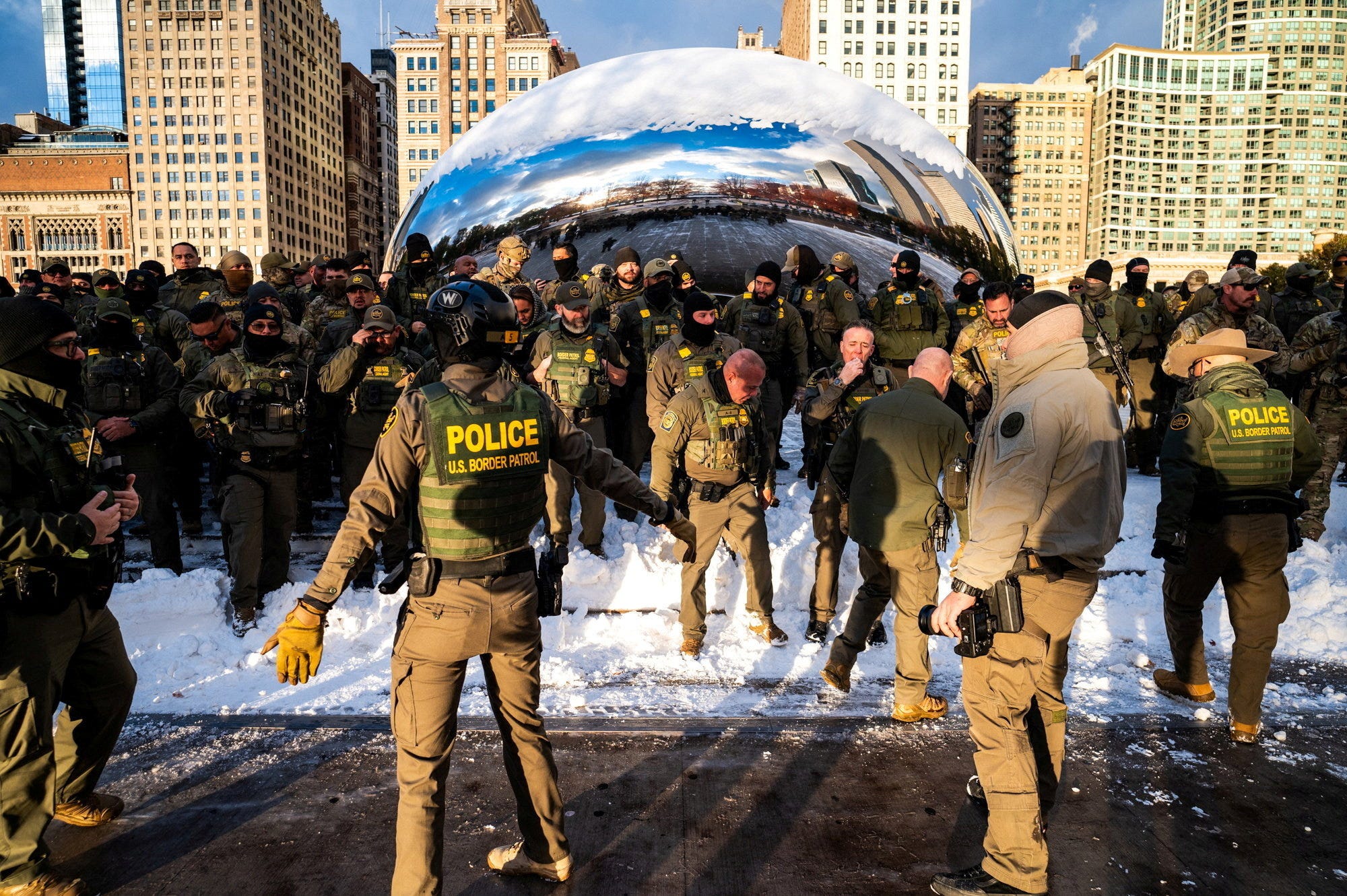 Trump Midway Blitz enforcer poses in front of Chicago's Bean sculpture ...