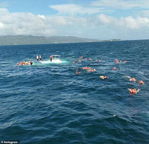 Moment cruise passengers are rescued from the sea after catamaran sinks ...