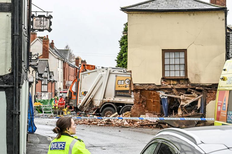 Man dies after bin lorry crashes into building