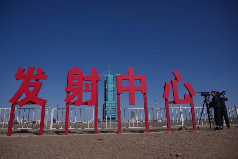 China's stranded astronauts 'in good condition' after space debris ...