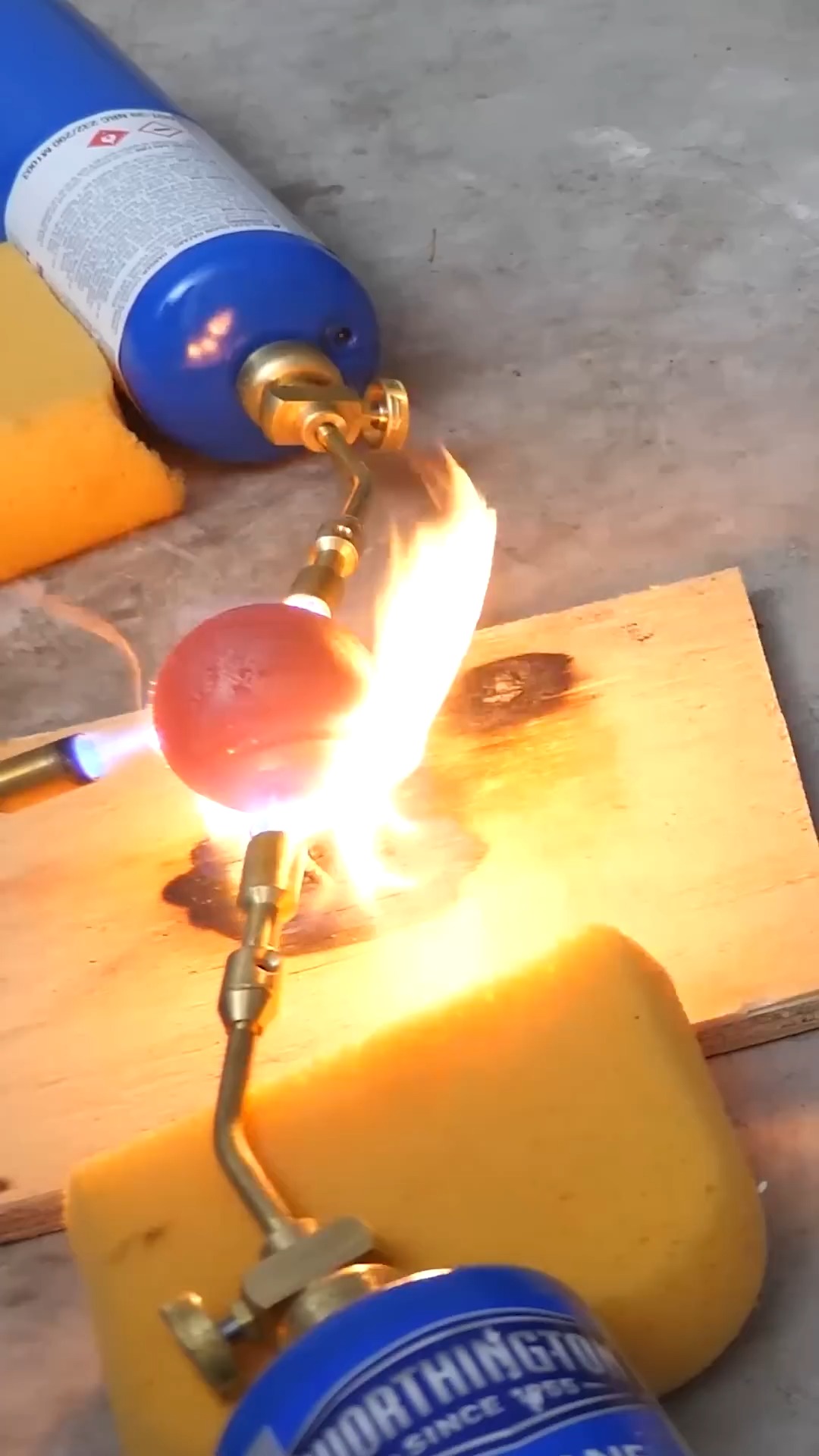 How long does it take for a red hot steel ball to cool in a vacuum chamber?