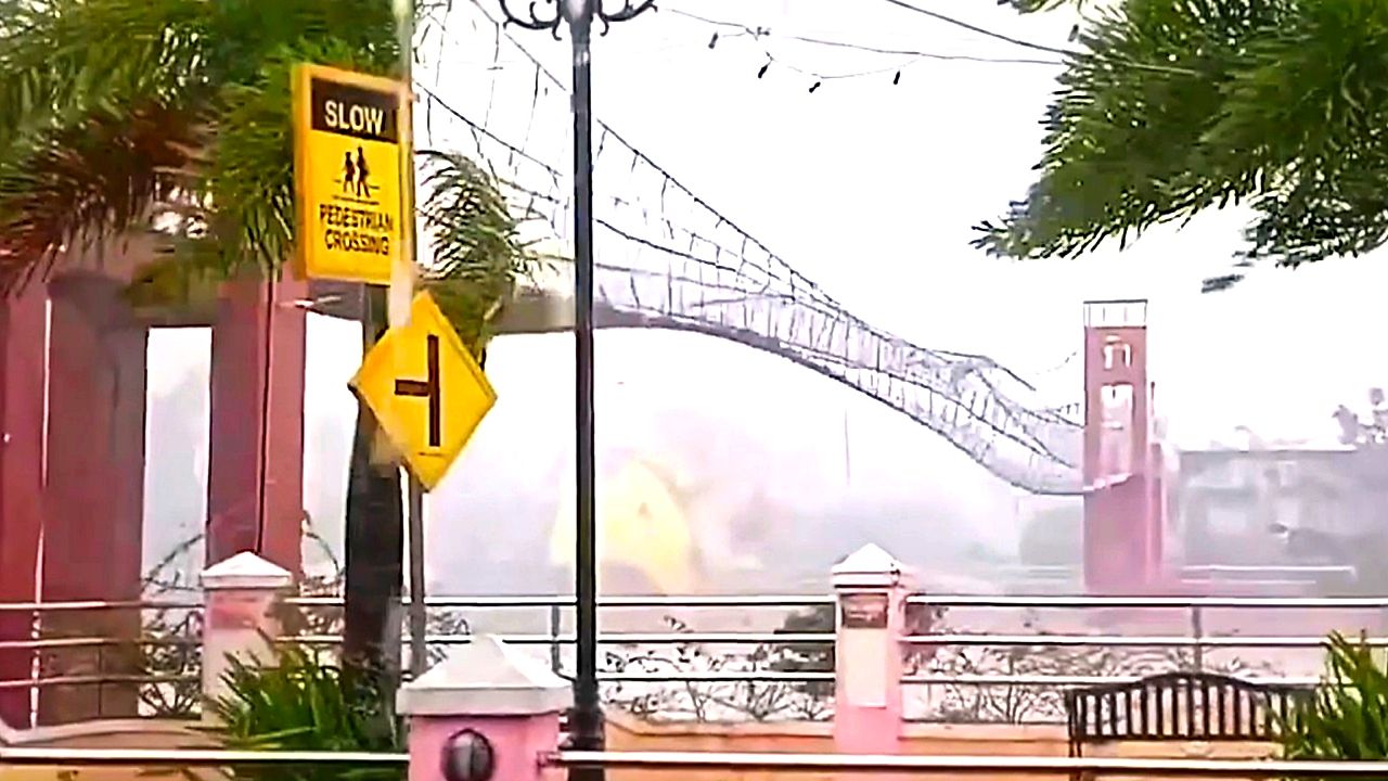 Pedestrian bridge swings wildly as Typhoon Fung-wong slams Philippines