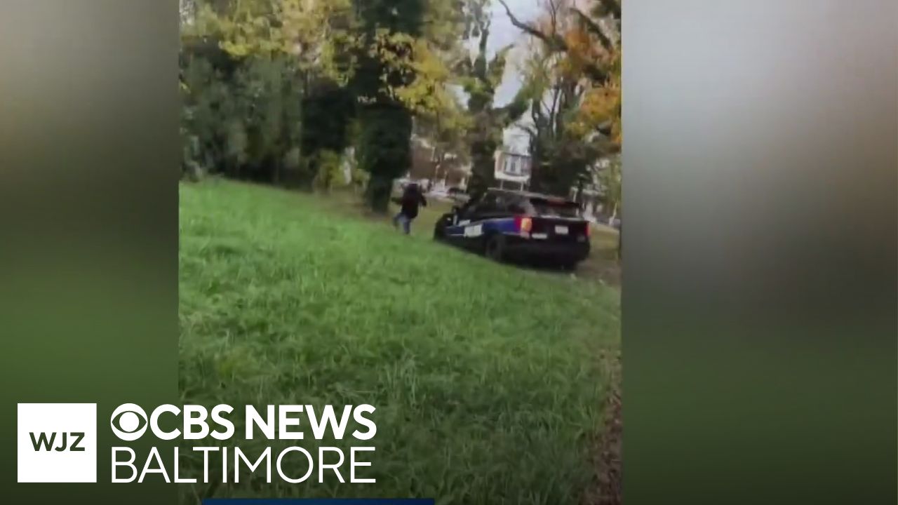 Baltimore officer suspended without pay after video shows him chasing ...