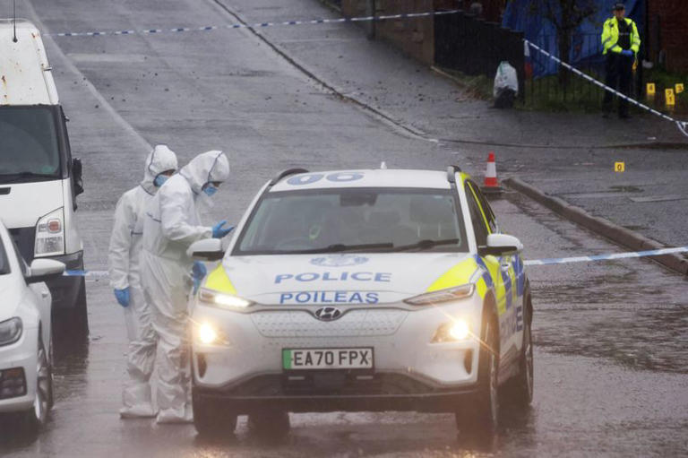 Forensic cops comb Greenock street as blue tent erected in garden