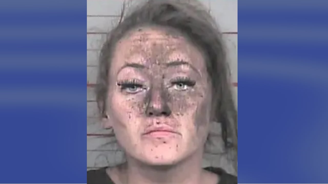 Woman arrested after police discover her between interior walls of business