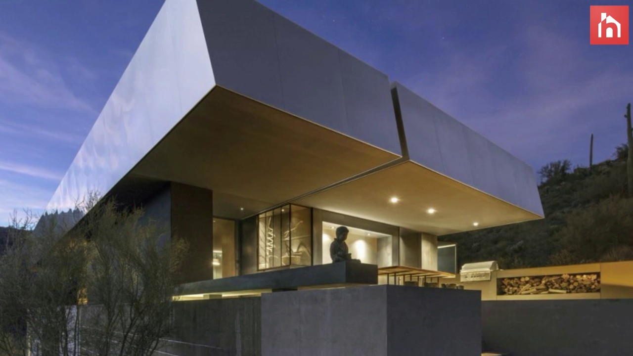 Contemporary house with a unique floor plan and a huge roof canopy