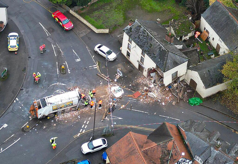 One dead and two injured after bin lorry smashes into house
