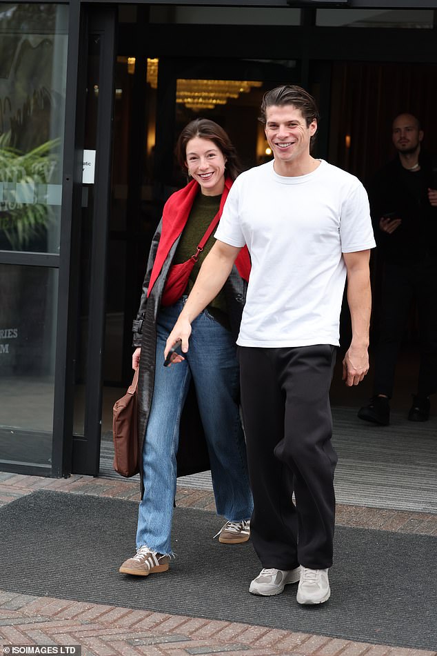 Strictly's Lewis Cope beams as he steps out with his rarely-seen ...