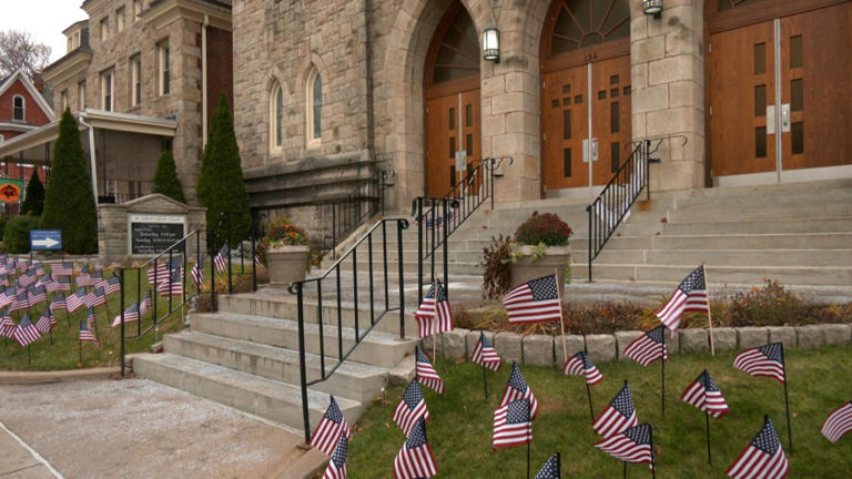 Students at Saint John Catholic School plant dozens of flags for ...