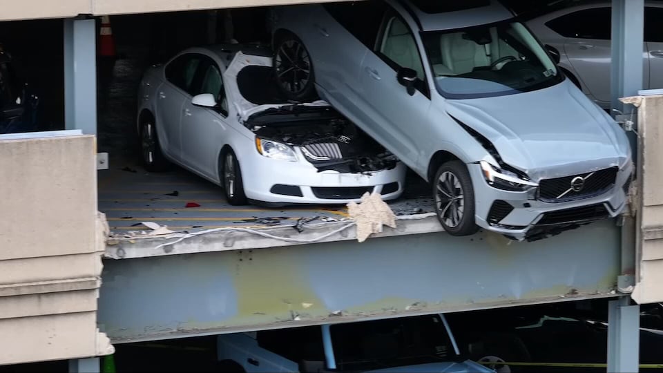 Vehicle hangs out of UPMC hospital parking garage after being hit by ...