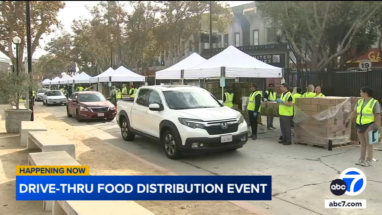 Food bank's drive-thru distribution event in Exposition Park attracts ...