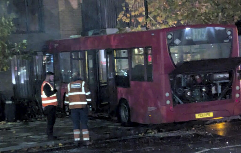 Dramatic pictures show London bus crashed into flat block