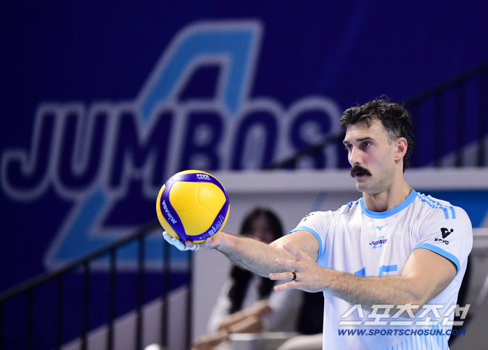 Russell for a powerful spike serve