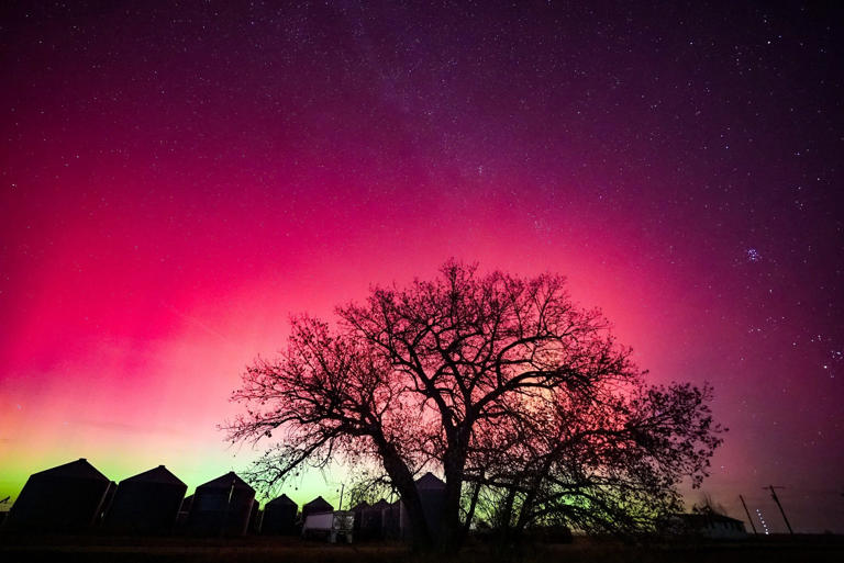See photos of northern lights dazzling the night sky over North America
