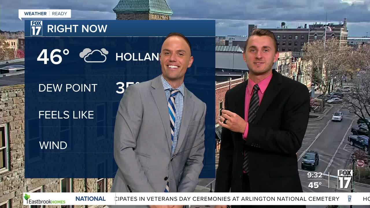 Elliot Grandia helps Reece Cole with weather