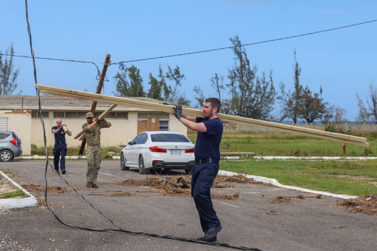 Hurricane Melissa: 39 pictures of helpful Royal Navy sailors repairing ...