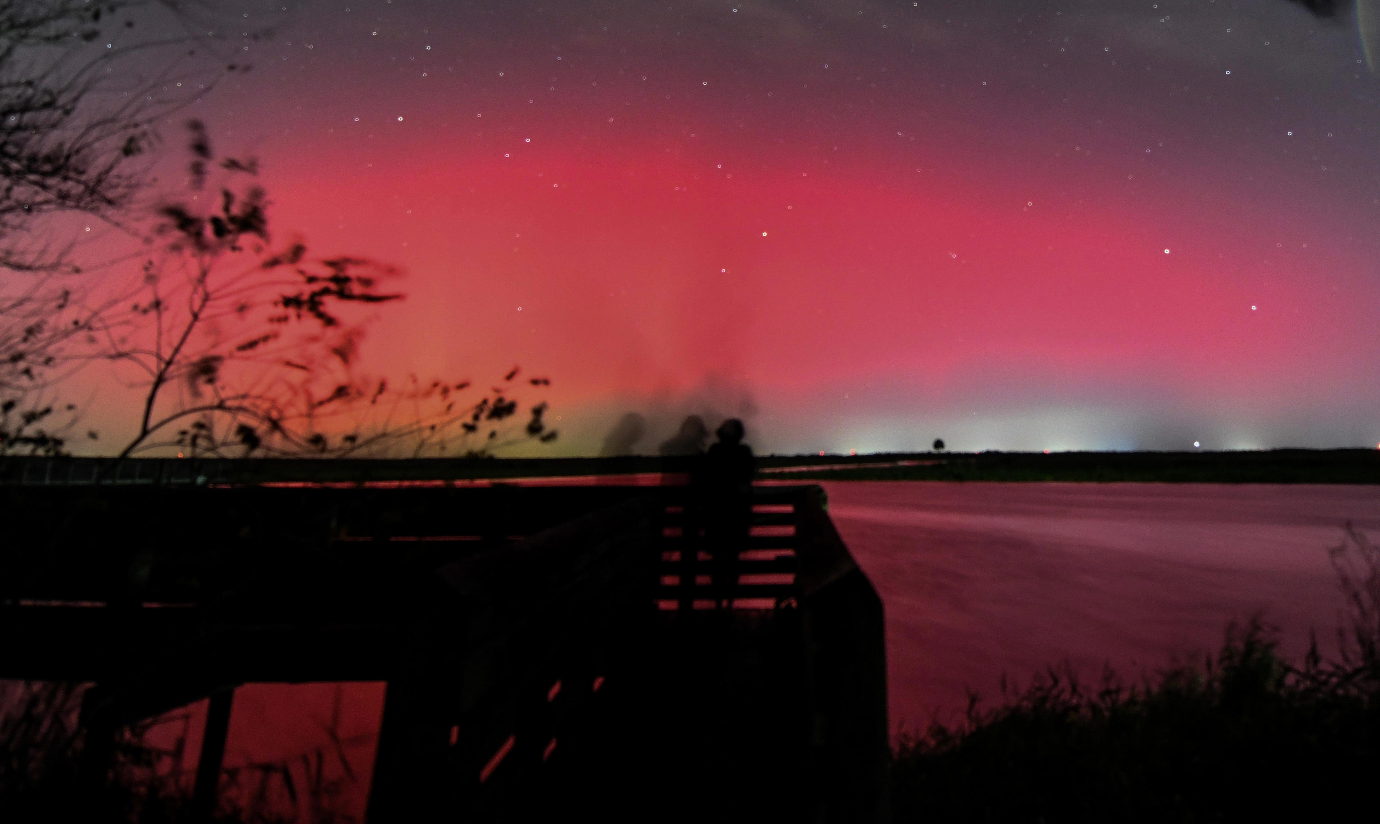 Northern lights dance over Space Coast Tuesday night, turning sky red
