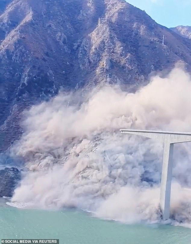 Terrifying moment China's new 2,500ft bridge collapses into river just ...